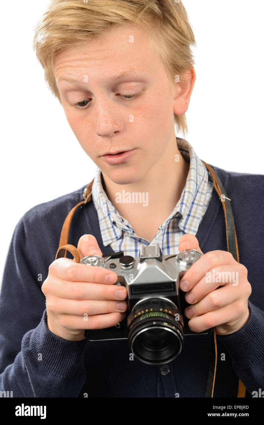 Teenage boy using retro camera Stock Photo - Alamy