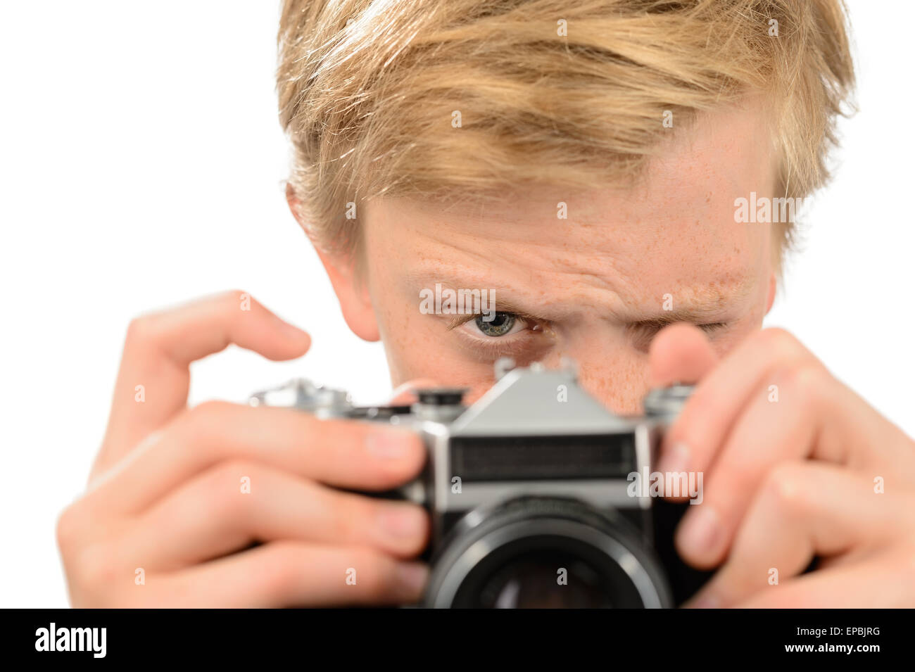 Boy photographing with retro camera Stock Photo - Alamy