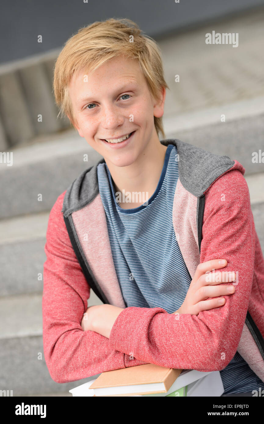 Portrait smiling student sitting stairs outdoors hi-res stock ...