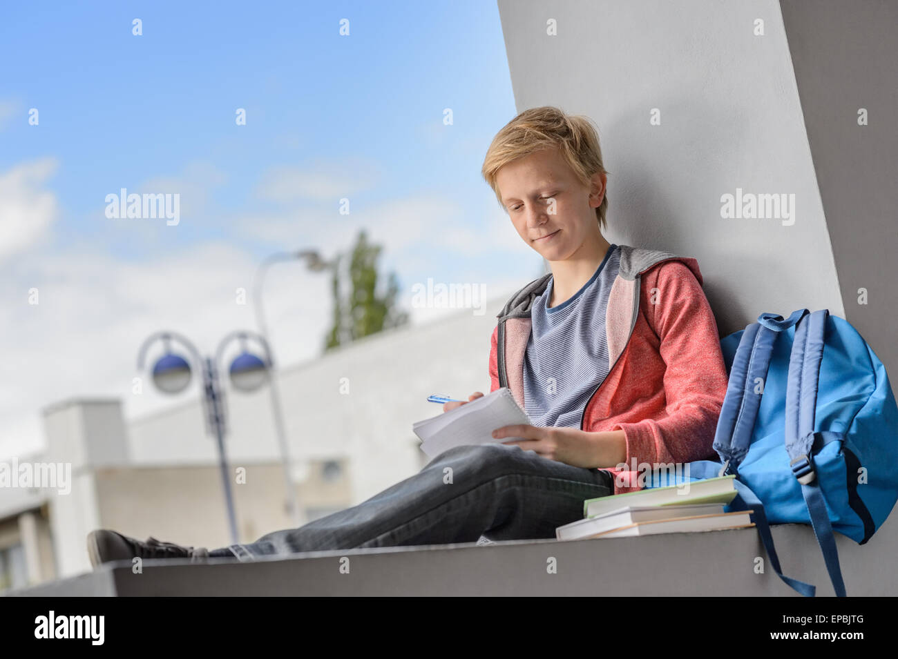 Student boy studying at university campus Stock Photo - Alamy