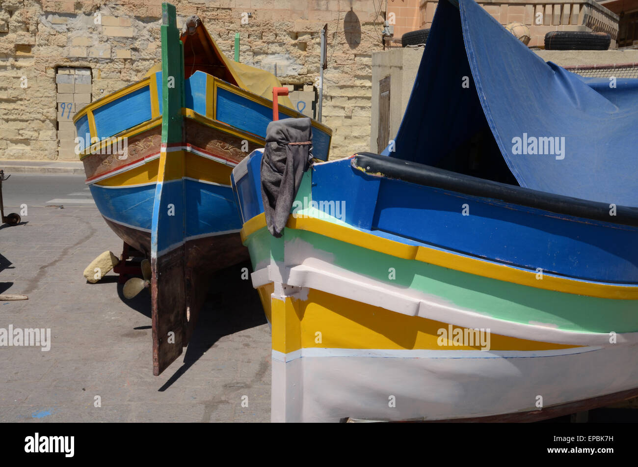 Traditional Maltese luzzu in Marsaxlokk harbour Stock Photo - Alamy