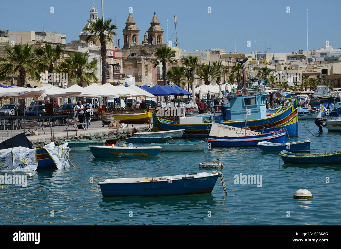 Traditional Maltese luzzu in Marsaxlokk harbour Stock Photo - Alamy