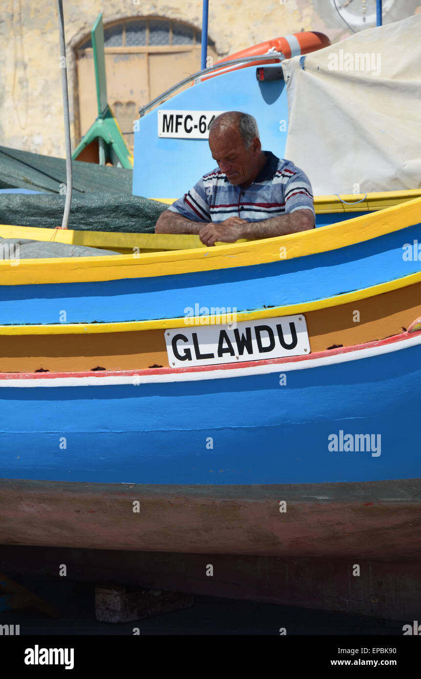 Traditional Maltese luzzu in Marsaxlokk harbour Stock Photo - Alamy