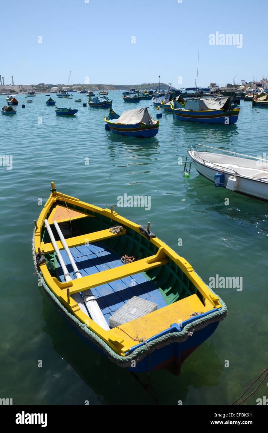 Traditional Maltese luzzu in Marsaxlokk harbour Stock Photo - Alamy