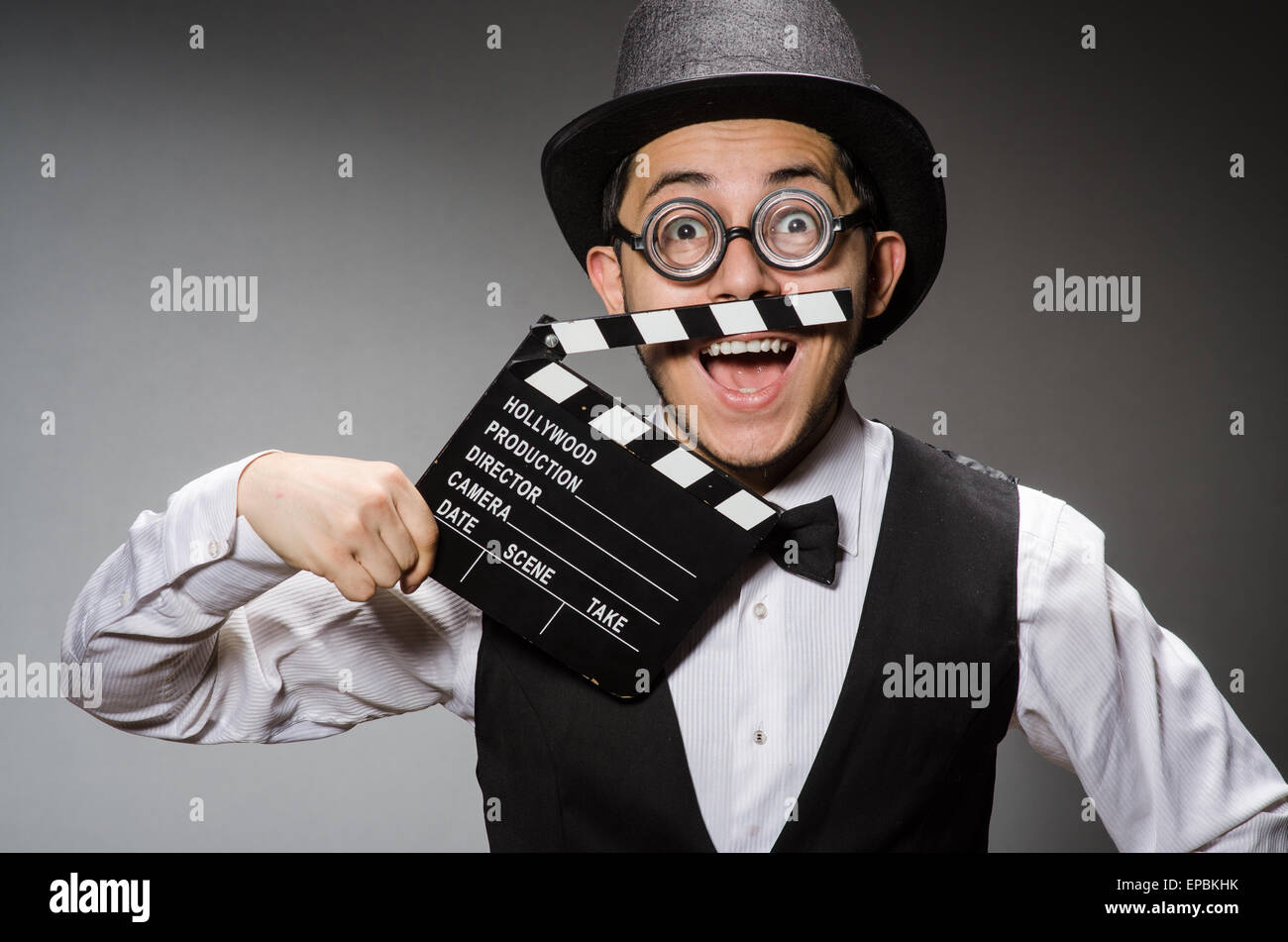 Funny man with movie clapper Stock Photo - Alamy