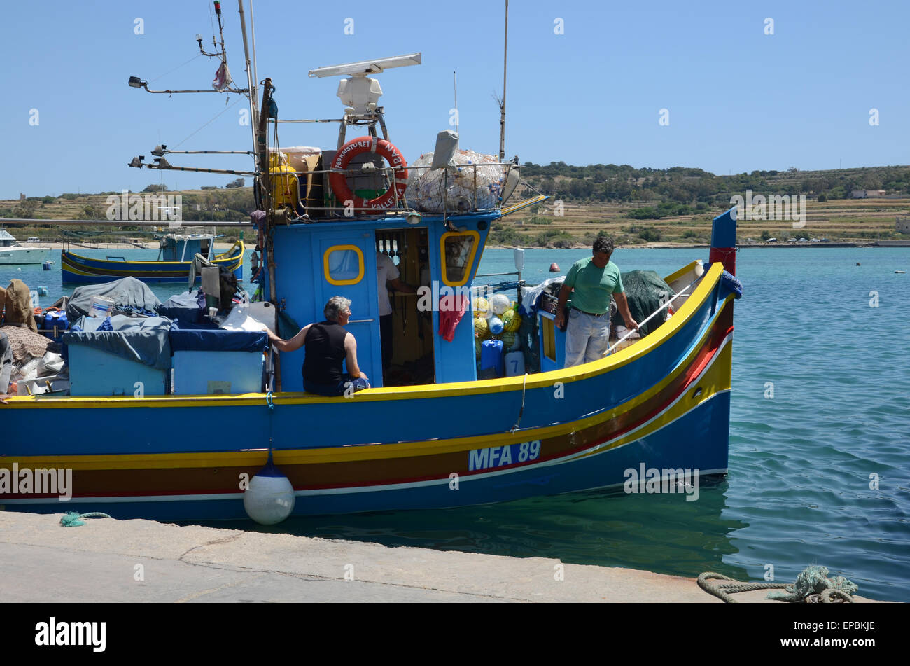 Traditional Maltese luzzu in Marsaxlokk harbour Stock Photo - Alamy