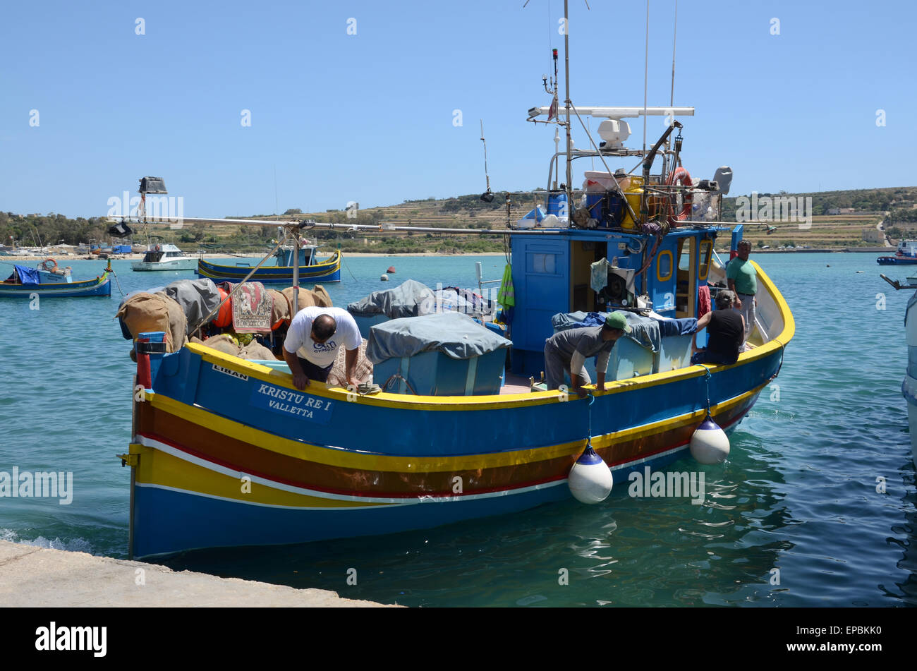 Traditional Maltese luzzu in Marsaxlokk harbour Stock Photo - Alamy