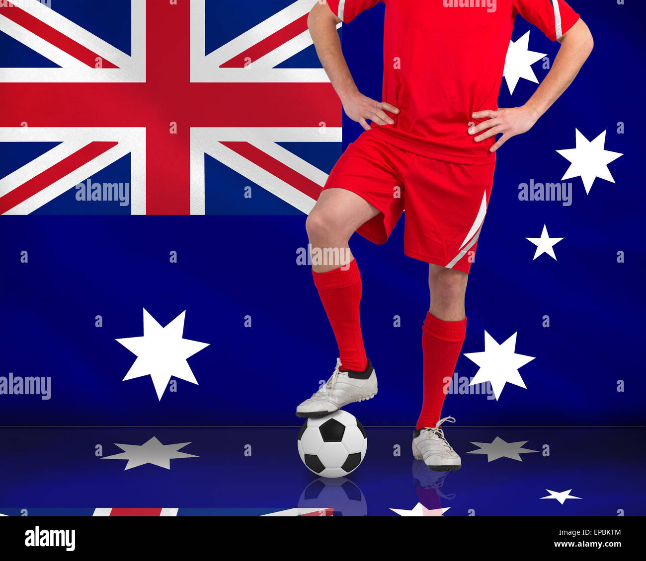 Football player standing with ball Stock Photo - Alamy