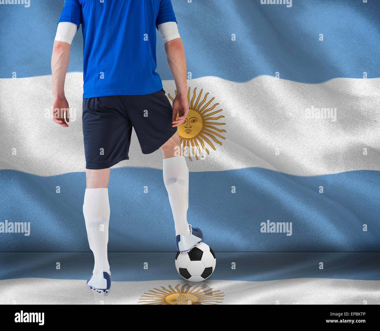 Football player standing with ball Stock Photo - Alamy