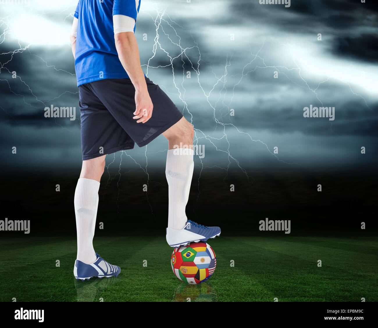 Football player standing with international ball Stock Photo - Alamy
