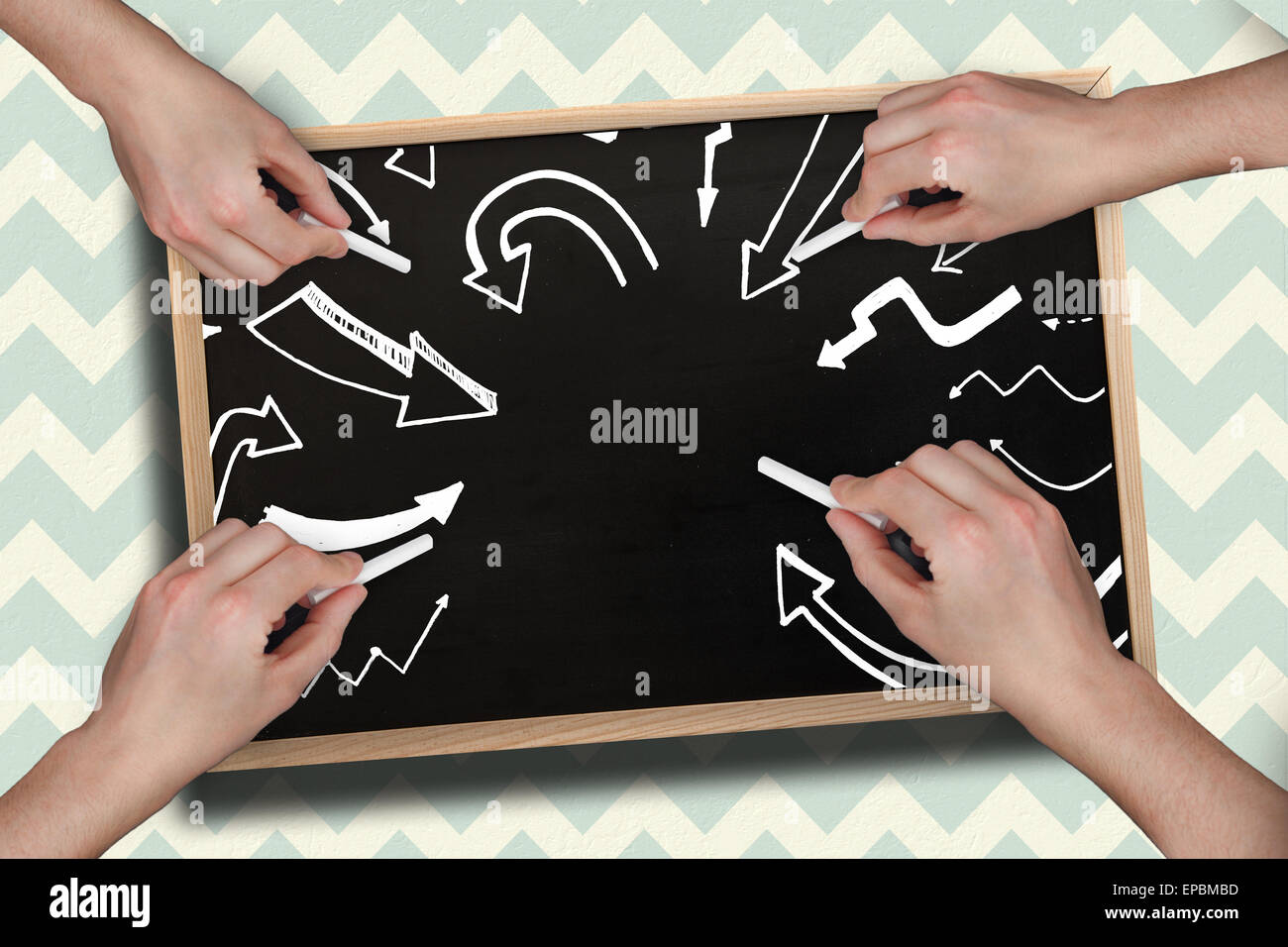 Composite image of multiple hands drawing arrows with chalk Stock Photo ...
