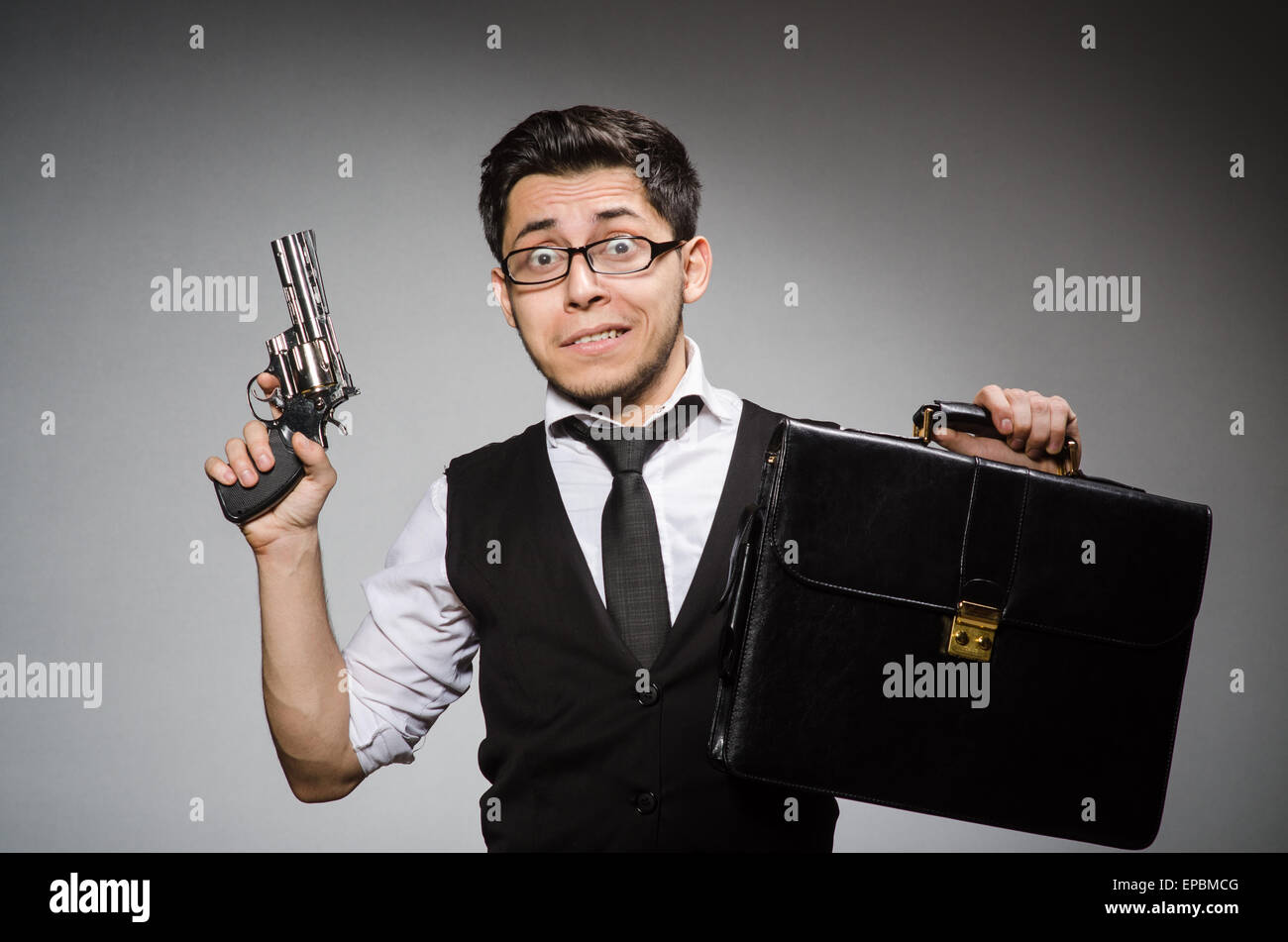 Man with gun and briefcase Stock Photo - Alamy