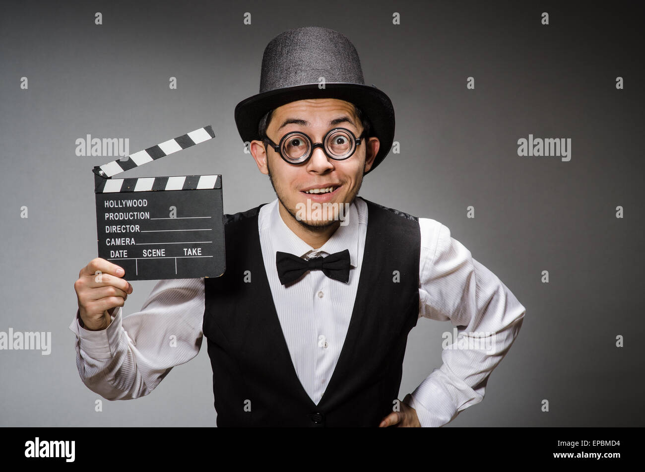 Funny man with movie clapper Stock Photo - Alamy