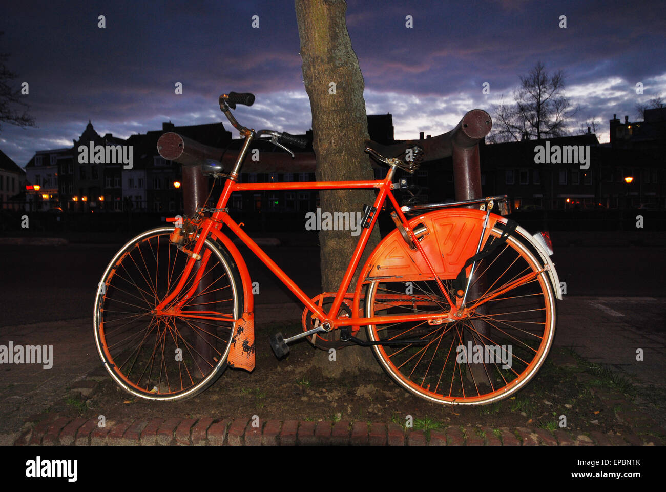Bicycle chained to a tree hi-res stock photography and images - Alamy