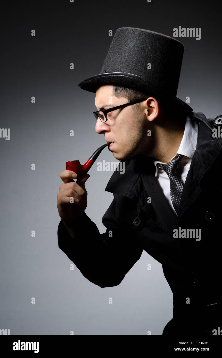 Funny detective with pipe and hat Stock Photo - Alamy