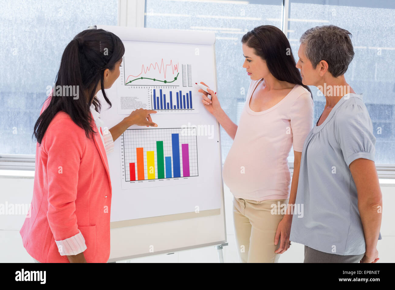 Attractive businesswoman making a presentation at work Stock Photo - Alamy