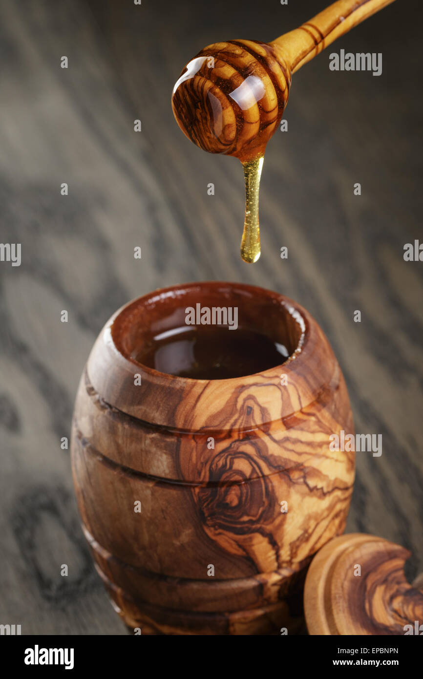 maple honey flowing from dipper to pot, rustic Stock Photo - Alamy