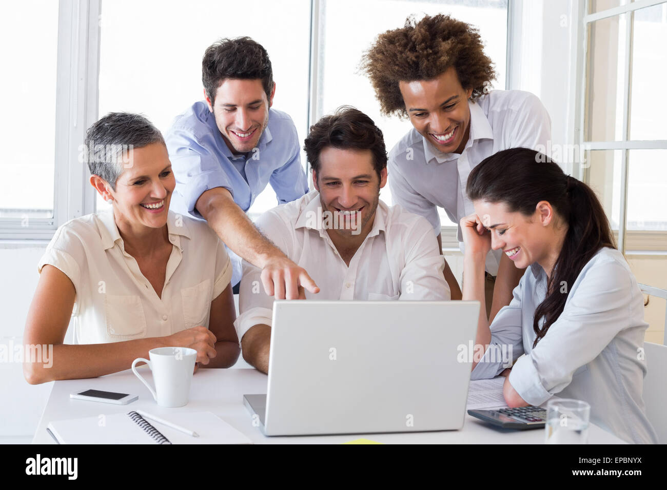 Attractive business people working in the office Stock Photo - Alamy