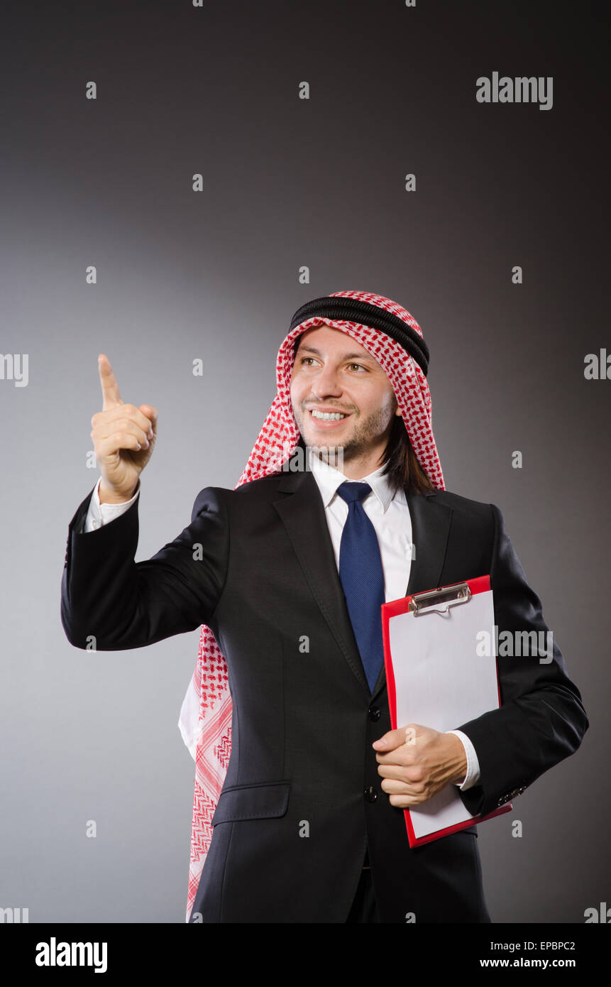 Arab man with paper binder Stock Photo - Alamy
