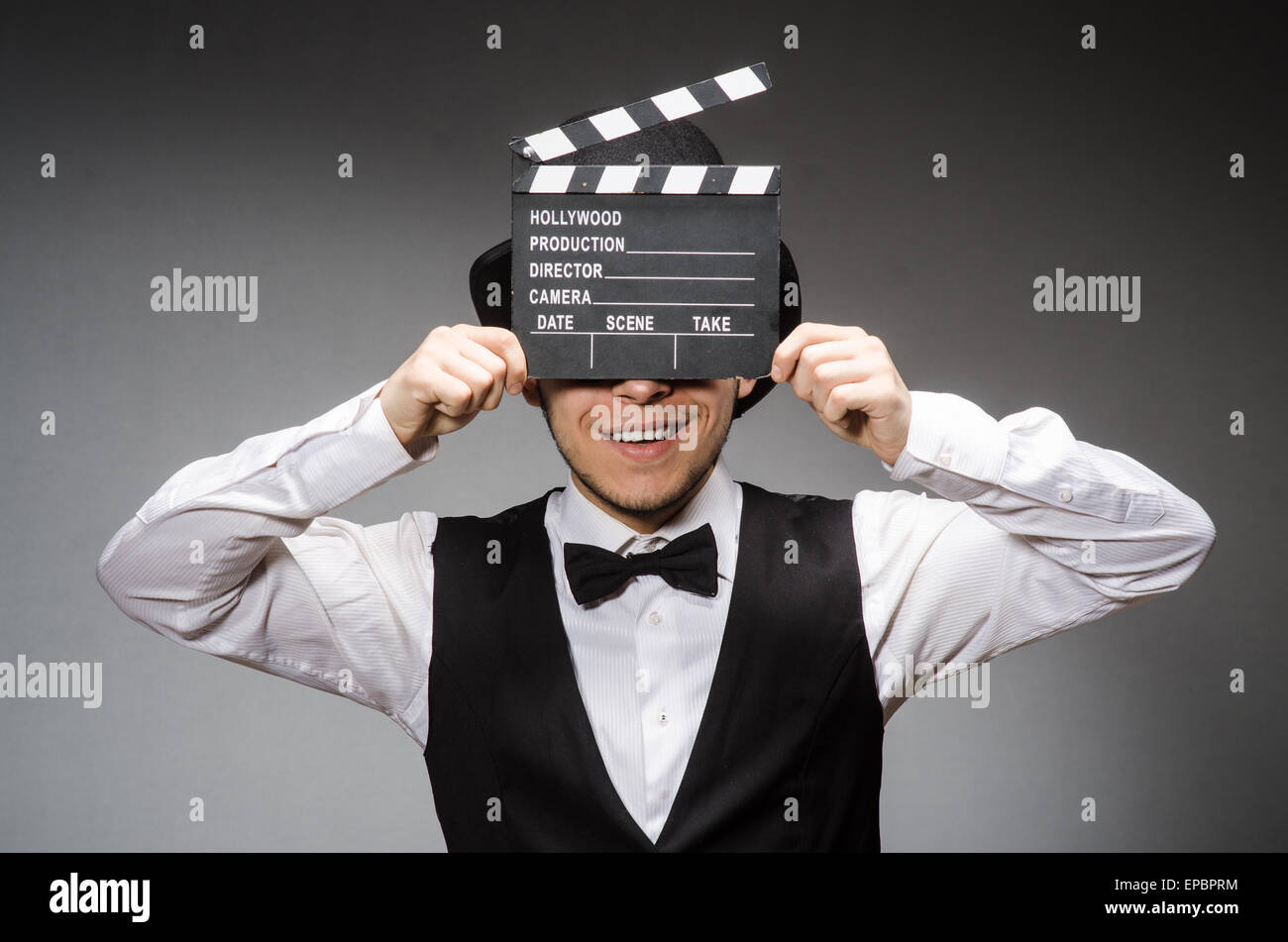 Funny man with movie clapper Stock Photo - Alamy