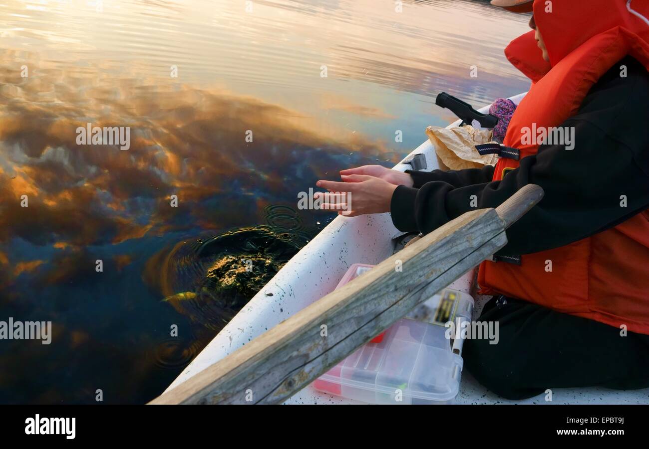 Fisherman releasing fish hi-res stock photography and images - Alamy