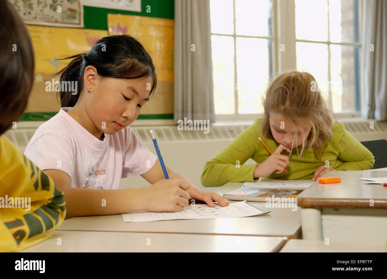 Girls working classroom students table hi-res stock photography and ...