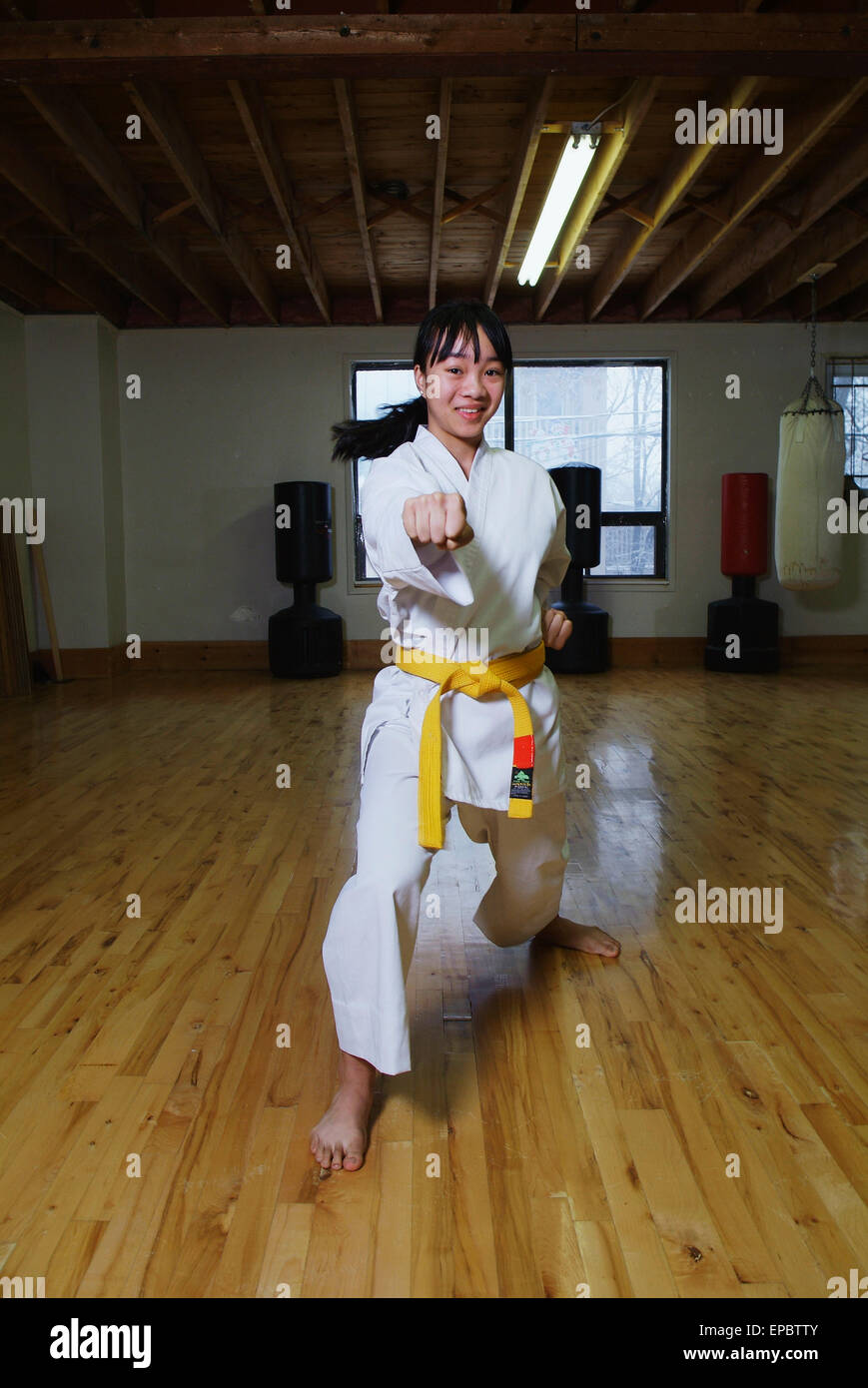 Girl in karate class demonstrating karate stance Stock Photo - Alamy