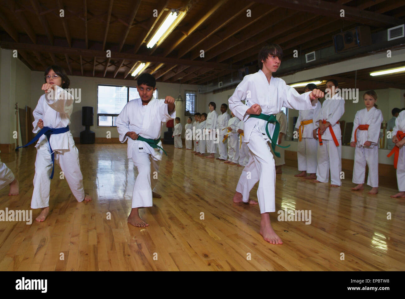 Kids demonstrating moves in karate class Stock Photo - Alamy