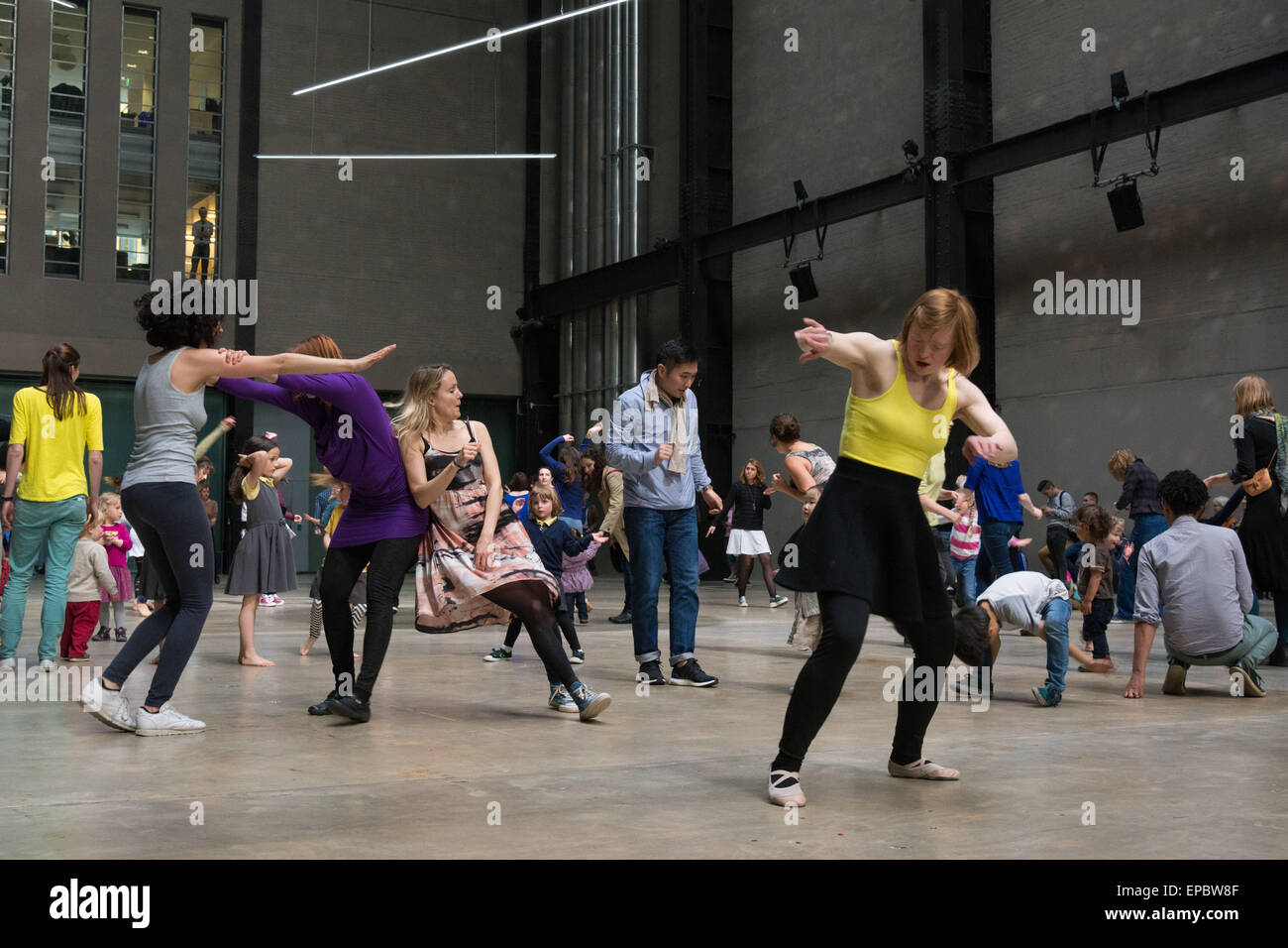 London, 15th May 2015. Dancers mingle with visitors in the Turbine Hall ...