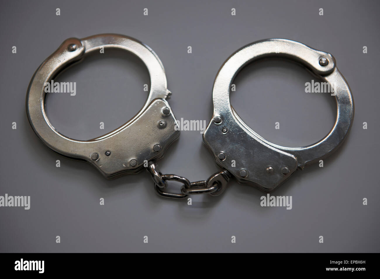 Pair of handcuffs hi-res stock photography and images - Alamy