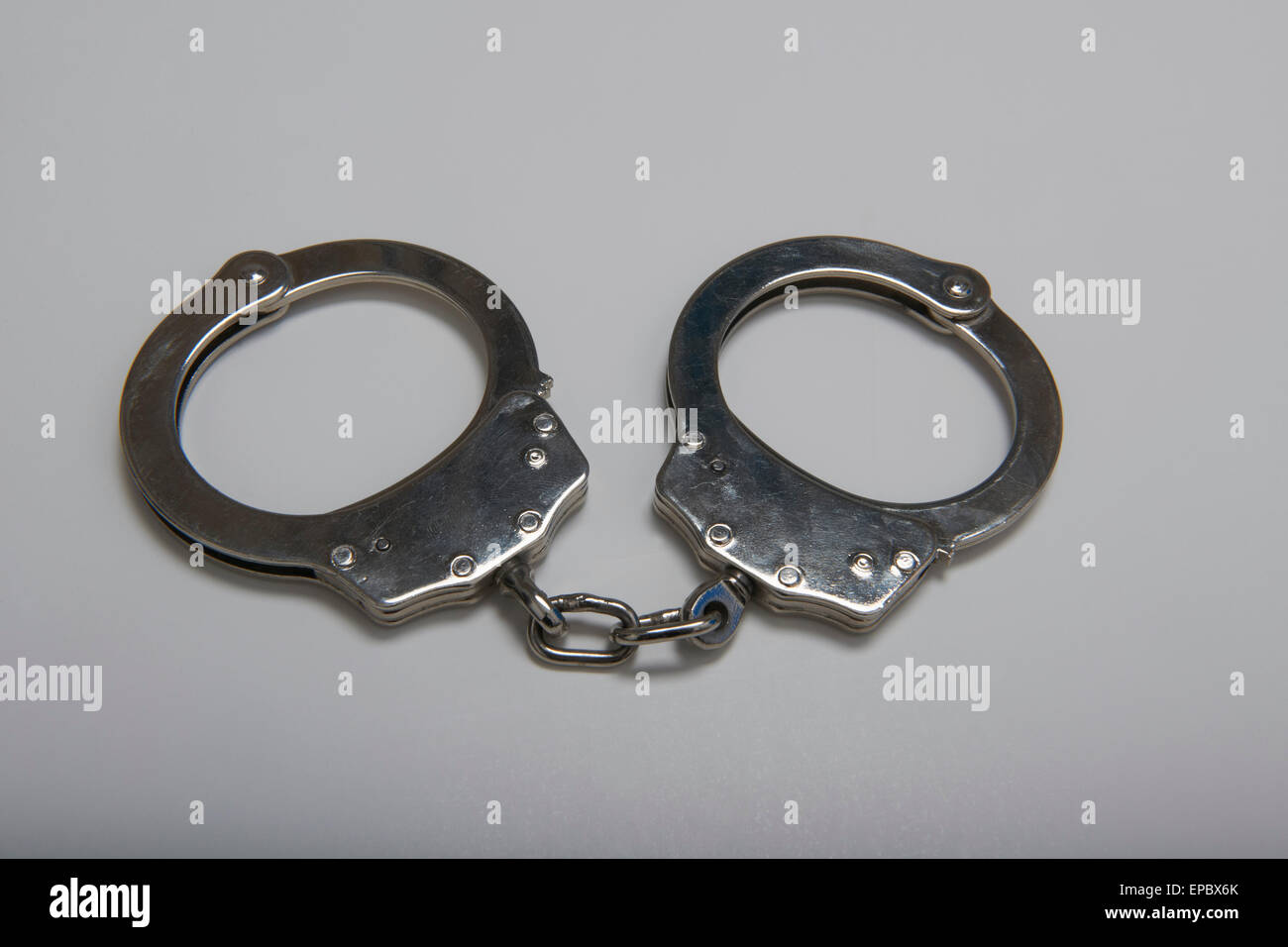 Close-up of a pair of handcuffs Stock Photo - Alamy