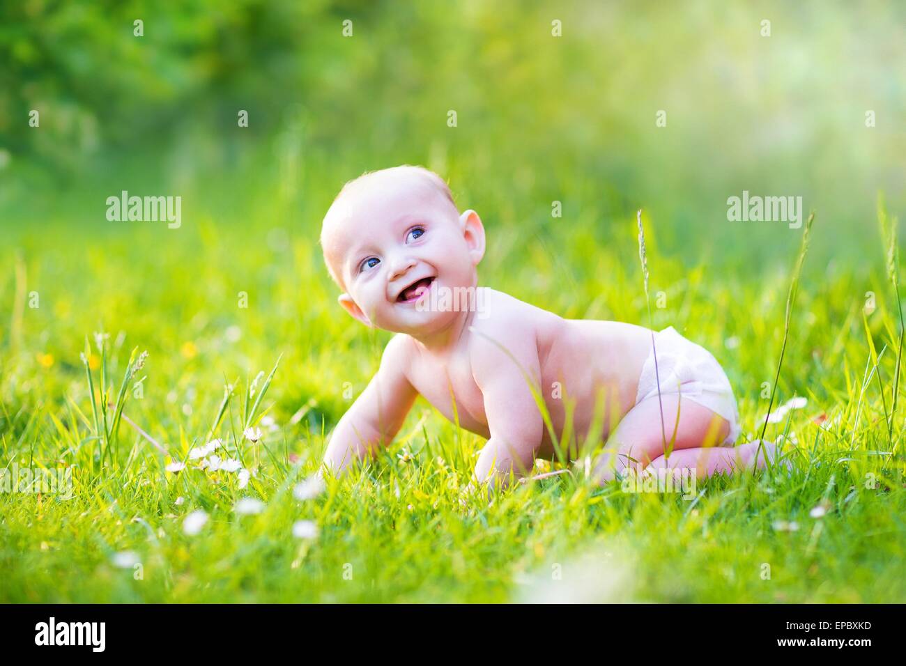 Little baby in garden Stock Photo - Alamy
