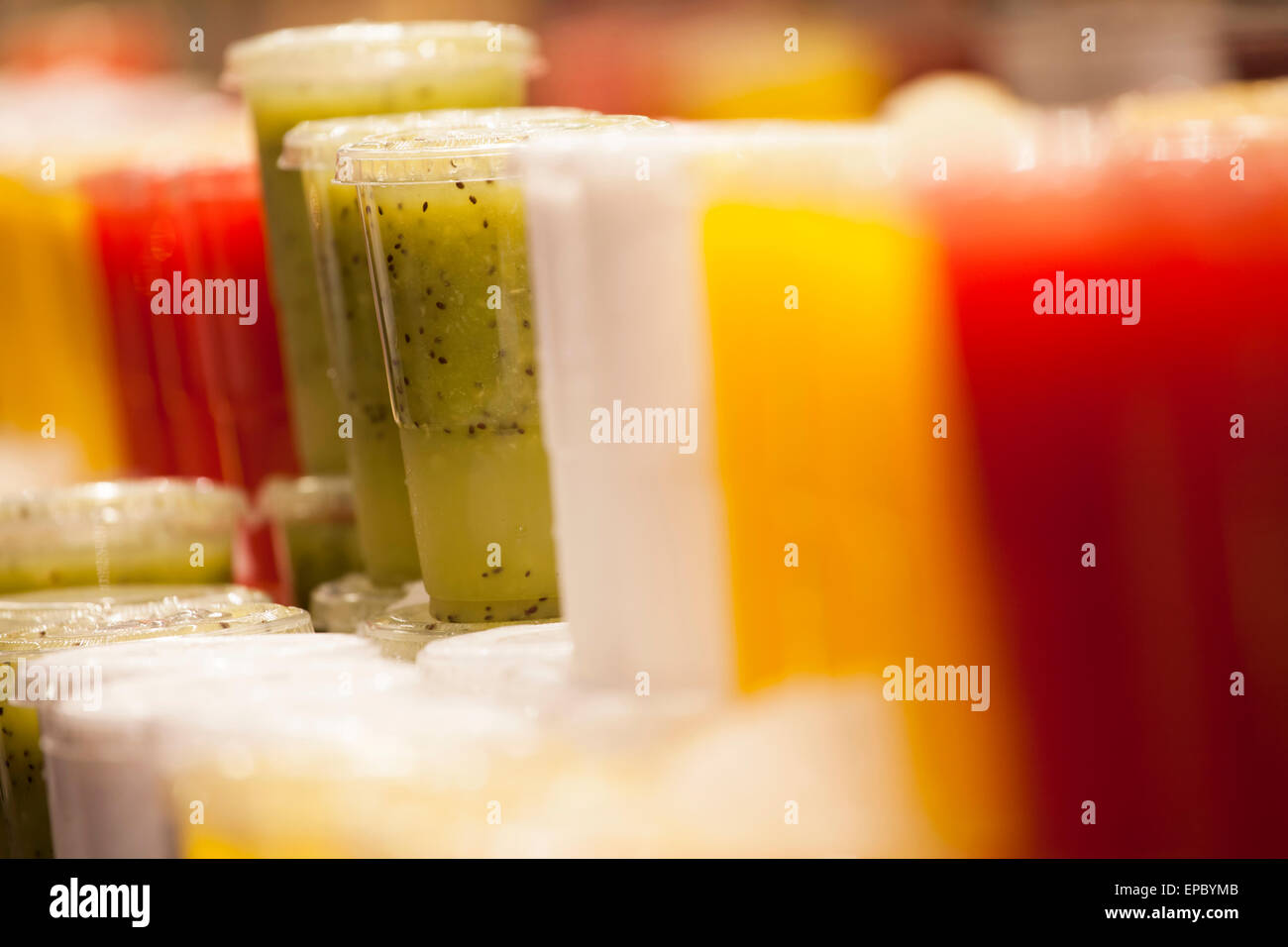 Fresh fruits juices exposed in the market Stock Photo - Alamy