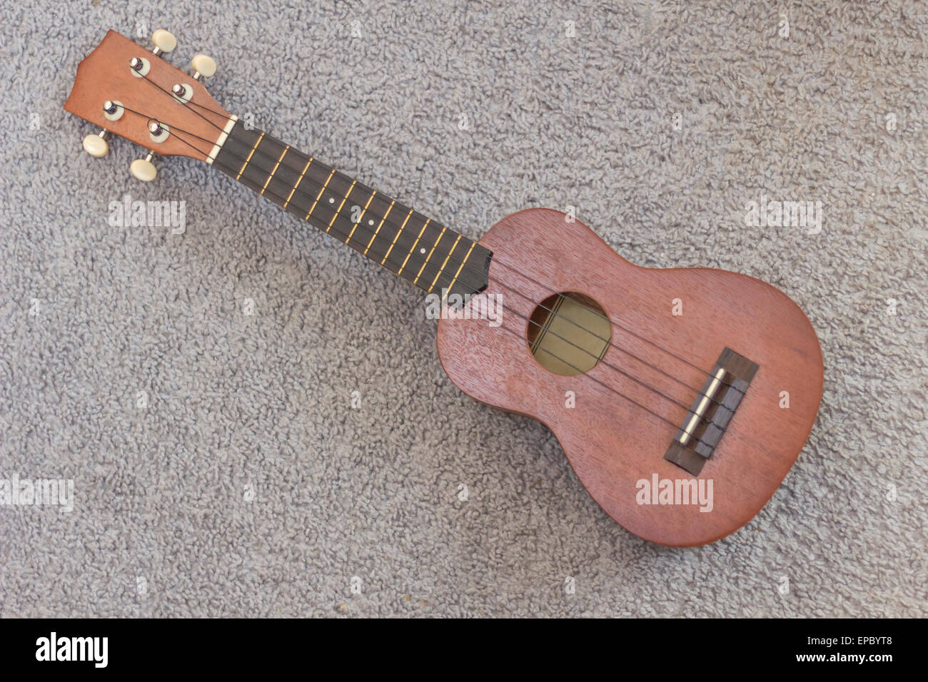 Soprano Ukelele an exotic wooden stringed instrument of the Hawaiian ...