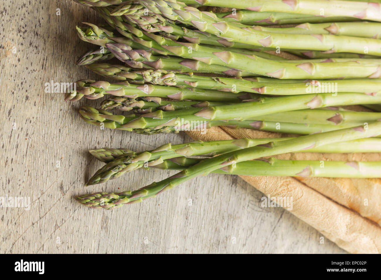 Fresh organic asparagus straight from the farmer's market on distressed ...