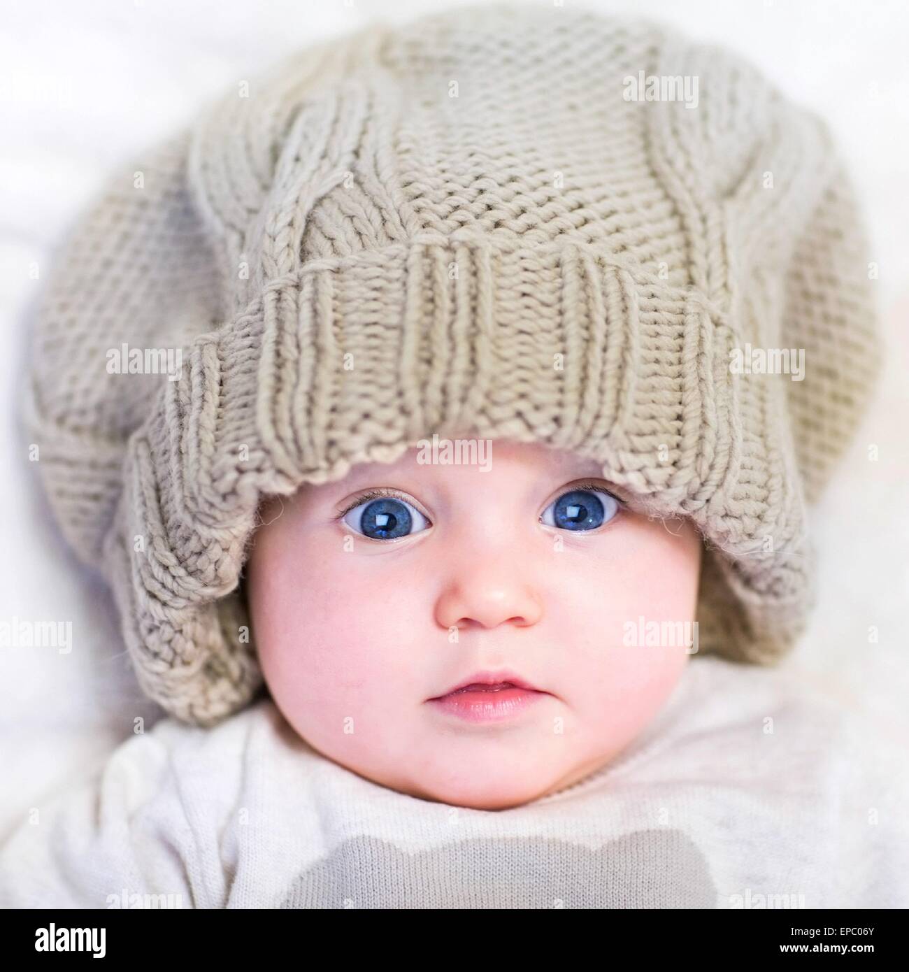 Baby in a knitted hat Stock Photo - Alamy