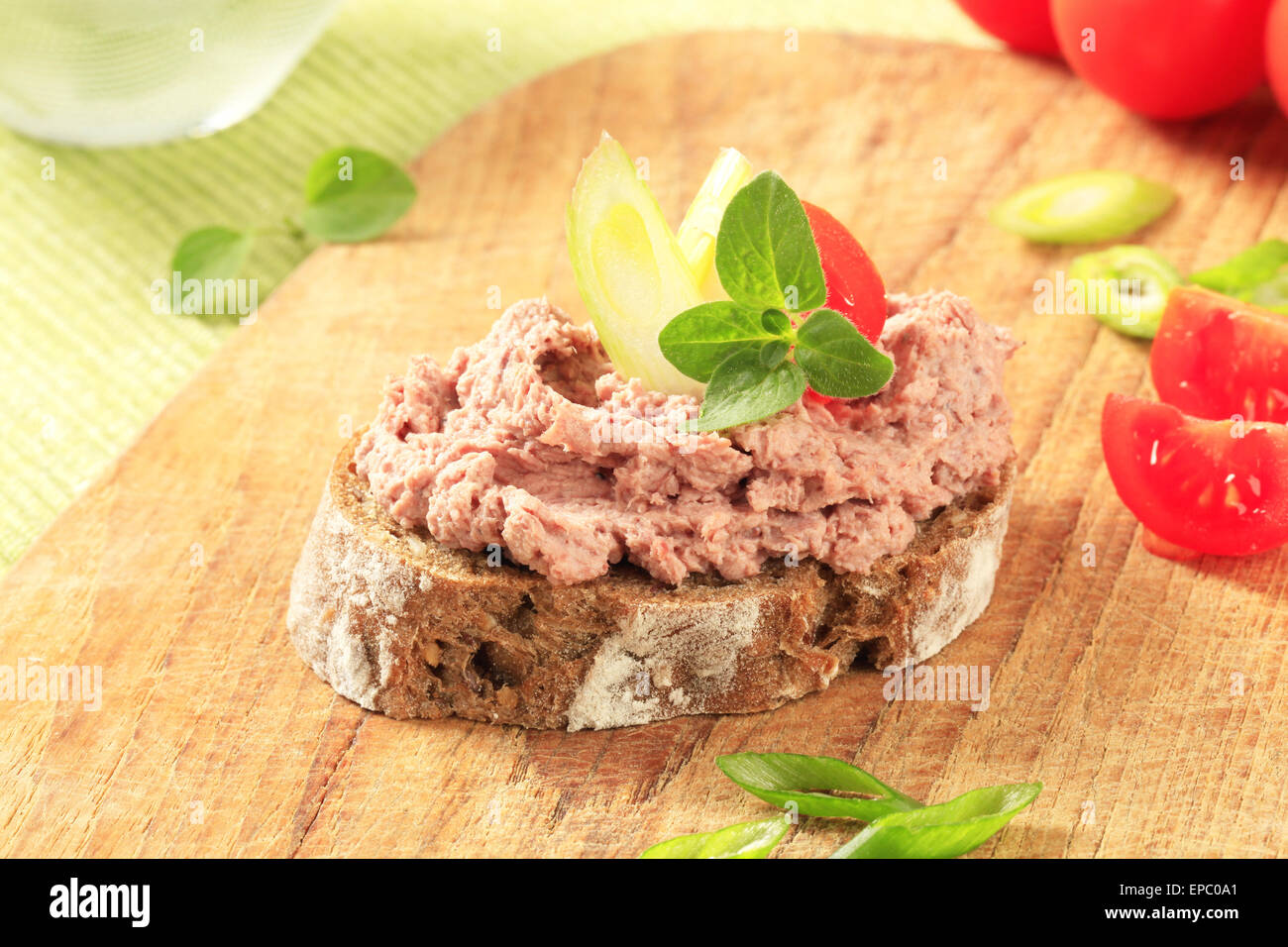 Slice of brown bread with meat spread Stock Photo - Alamy