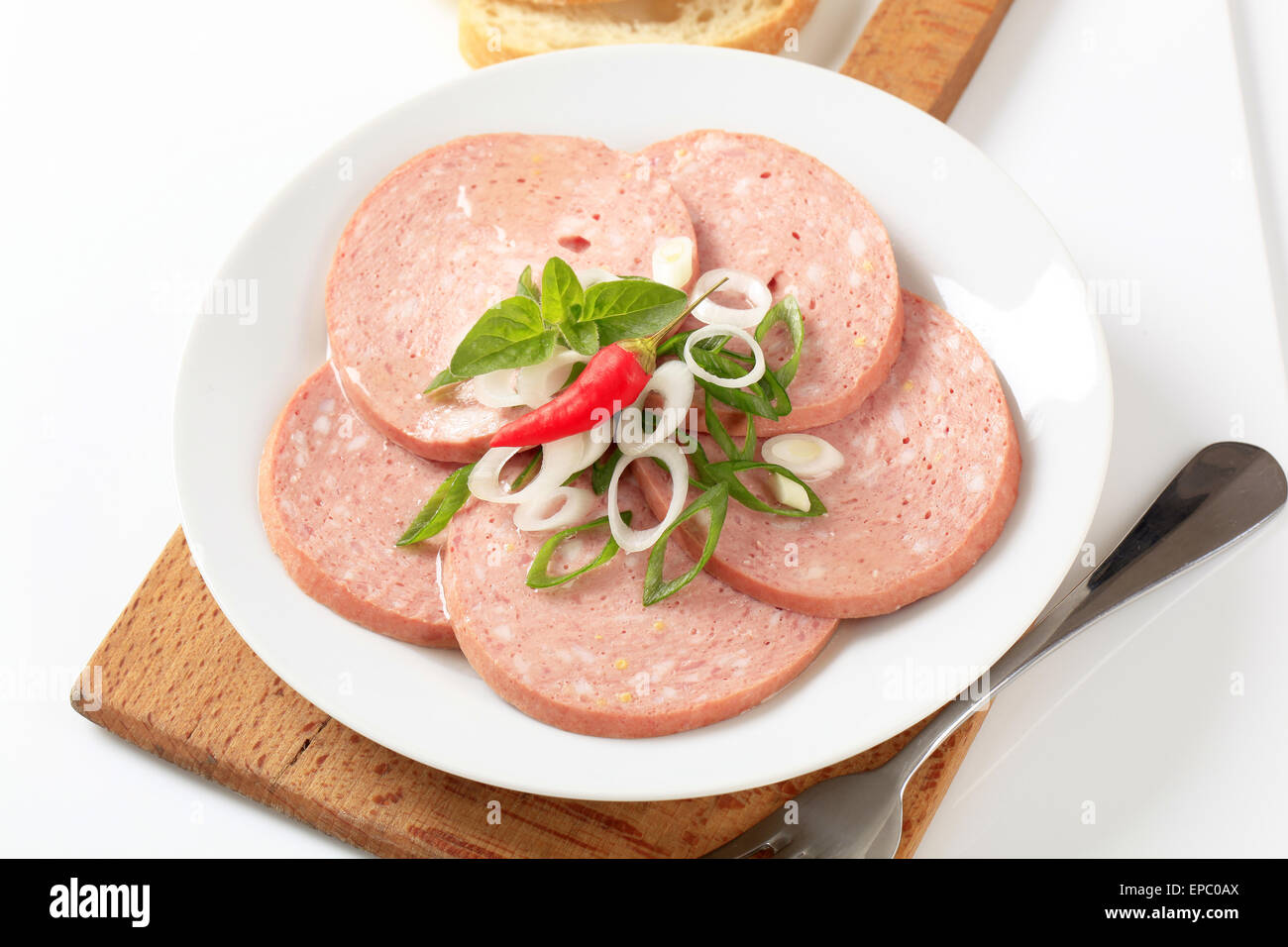 Sliced soft salami sausage sprinkled with onion Stock Photo - Alamy