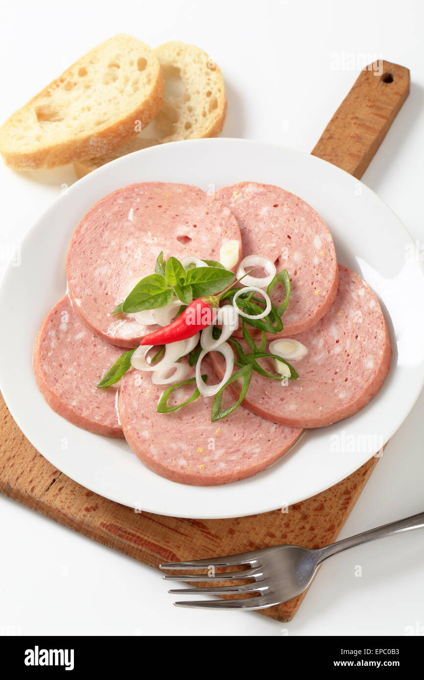 Sliced soft salami sausage sprinkled with onion Stock Photo - Alamy