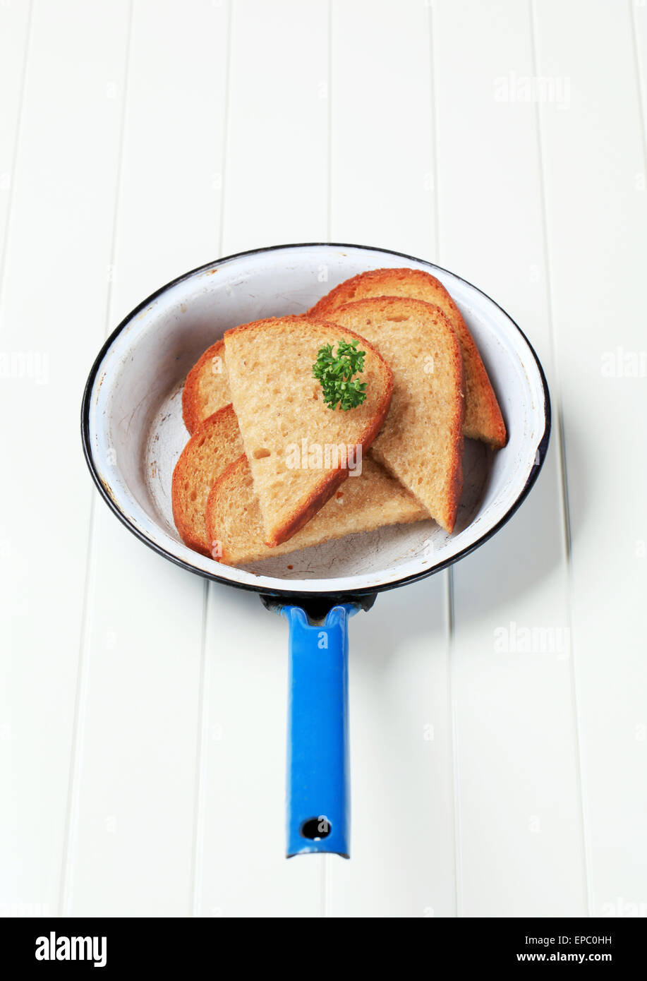 Slices of fried bread in a pan Stock Photo - Alamy