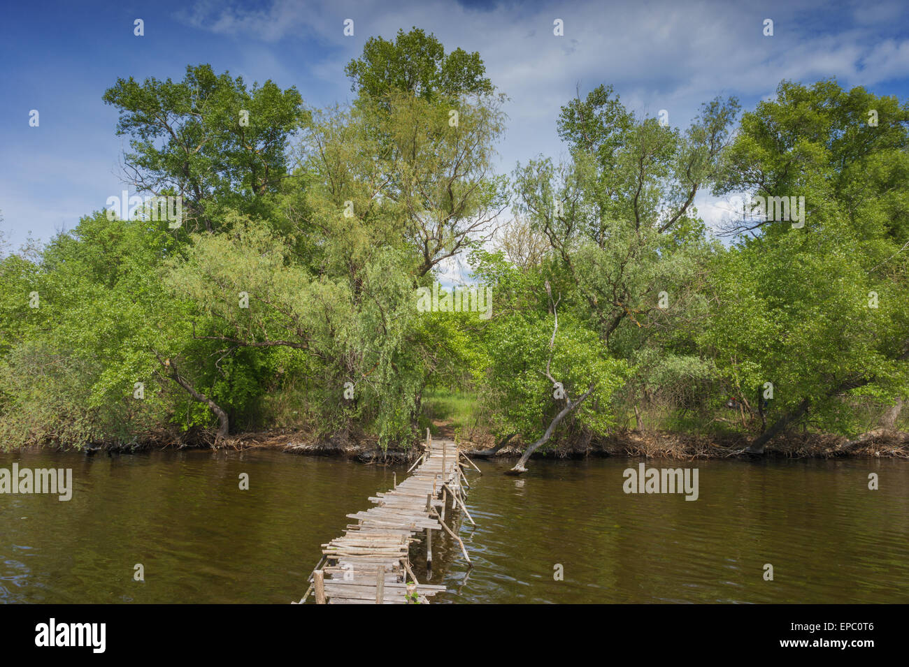 Old fishing bridge on the broad river Stock Photo - Alamy