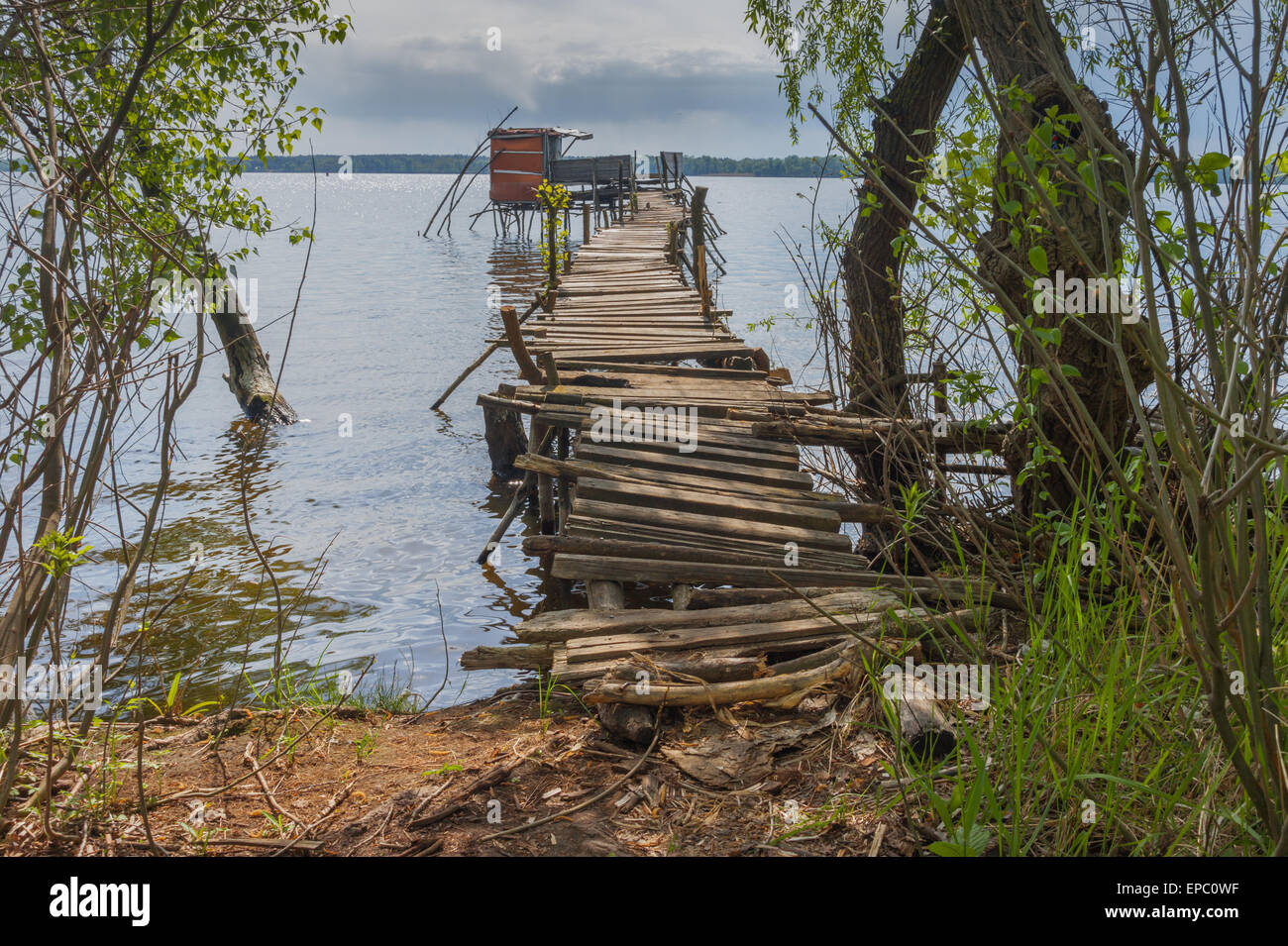 Old fishing bridge on the broad river Stock Photo - Alamy