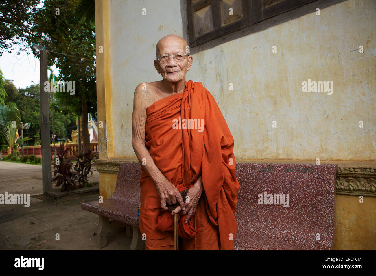 Elderly buddhist monk walking with cane hi-res stock photography and ...