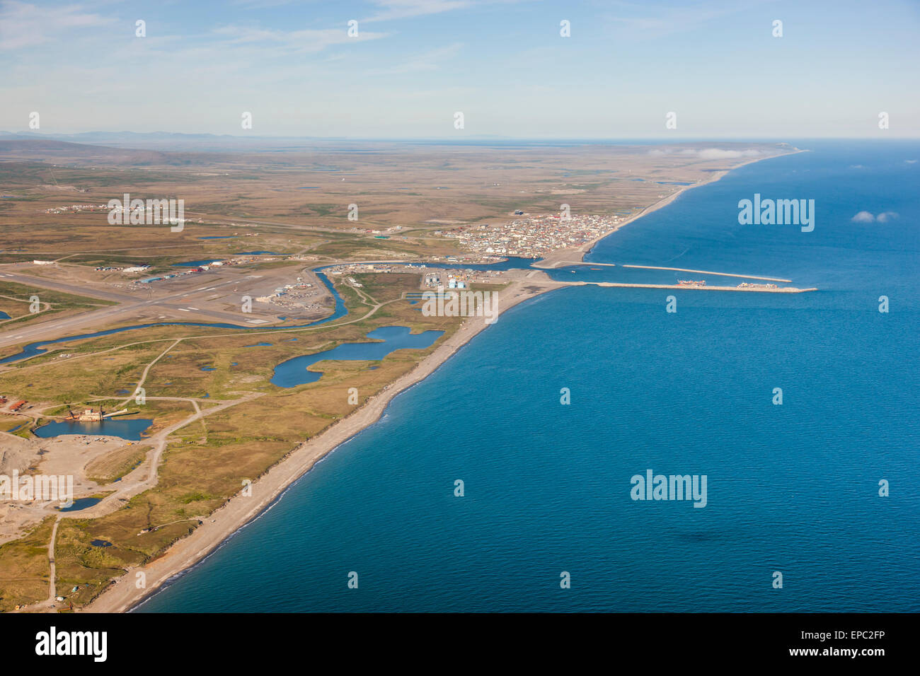An aerial view of the city of Nome with Norton sound and the sea wall ...