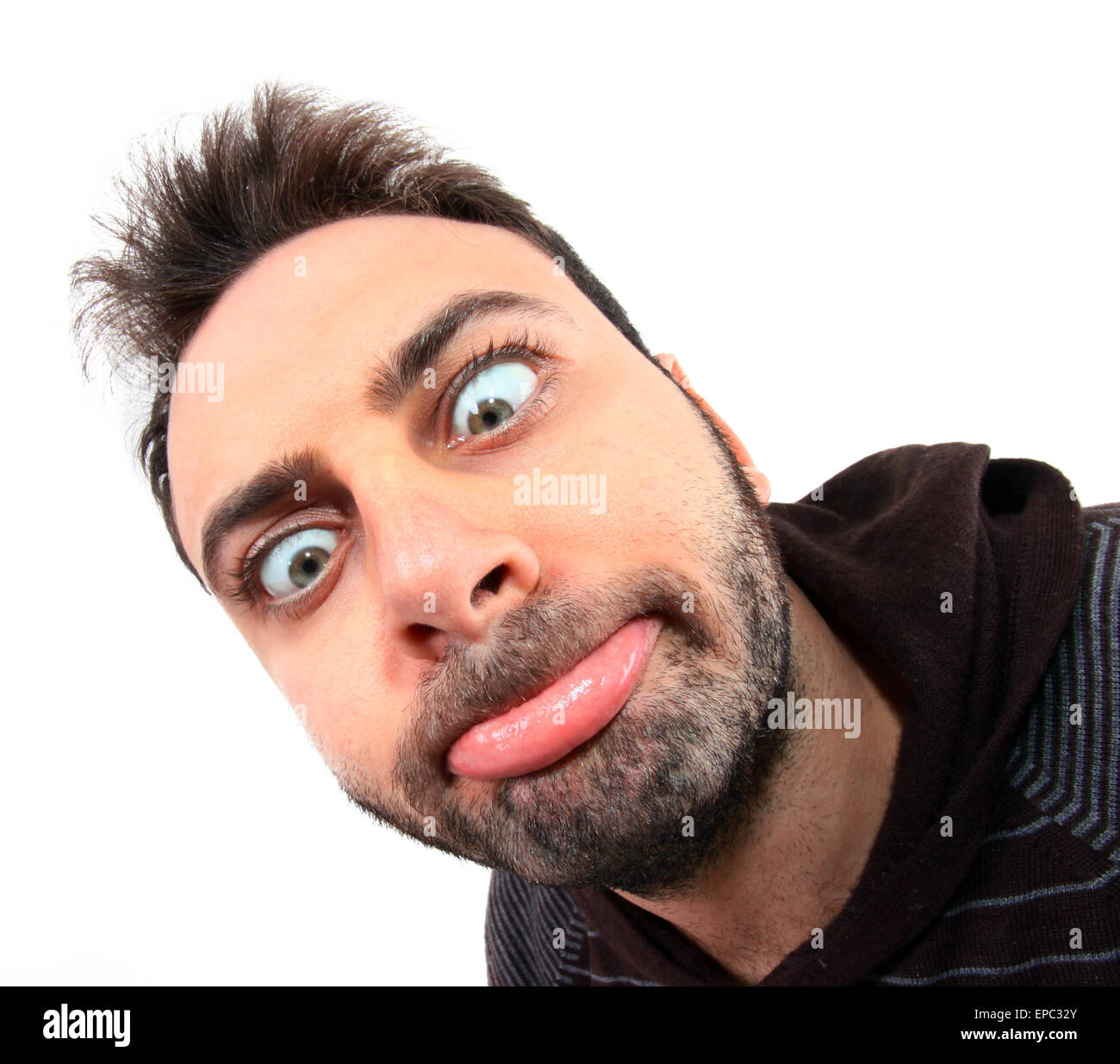 Young man with funny expression on white background Stock Photo - Alamy