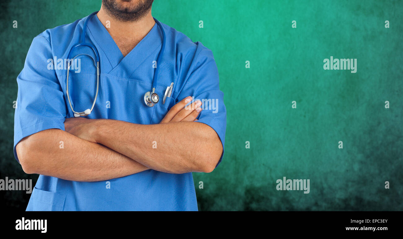 Close up of a man's arms crossed of medical staff on green white ...