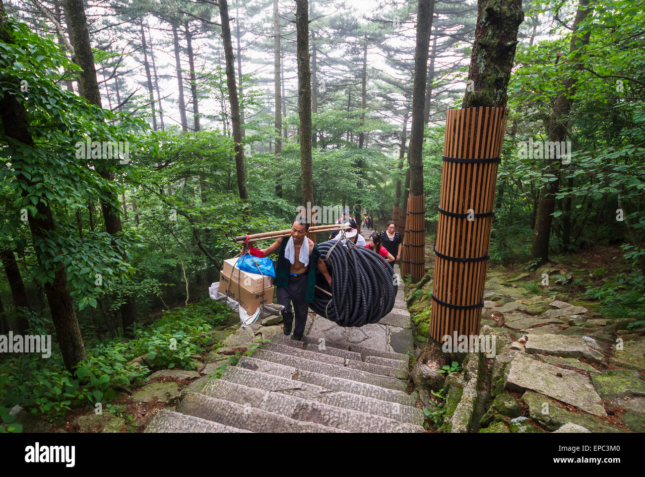 Porter carrying items, Mount Huangshan, Anhui, China Stock Photo - Alamy