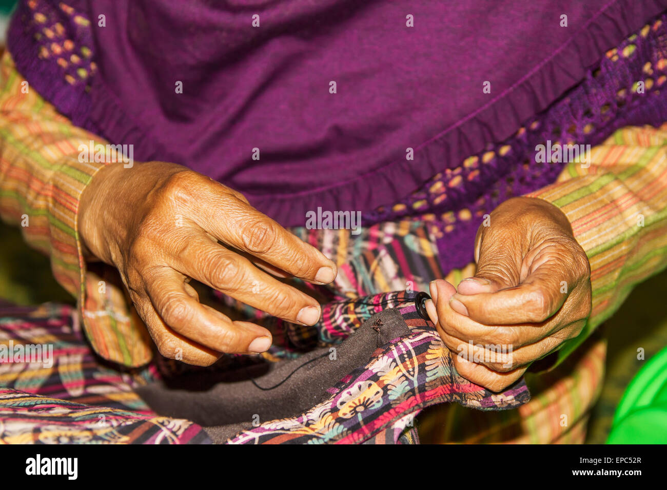 Woman Mending Clothes Stock Photos & Woman Mending Clothes Stock Images ...