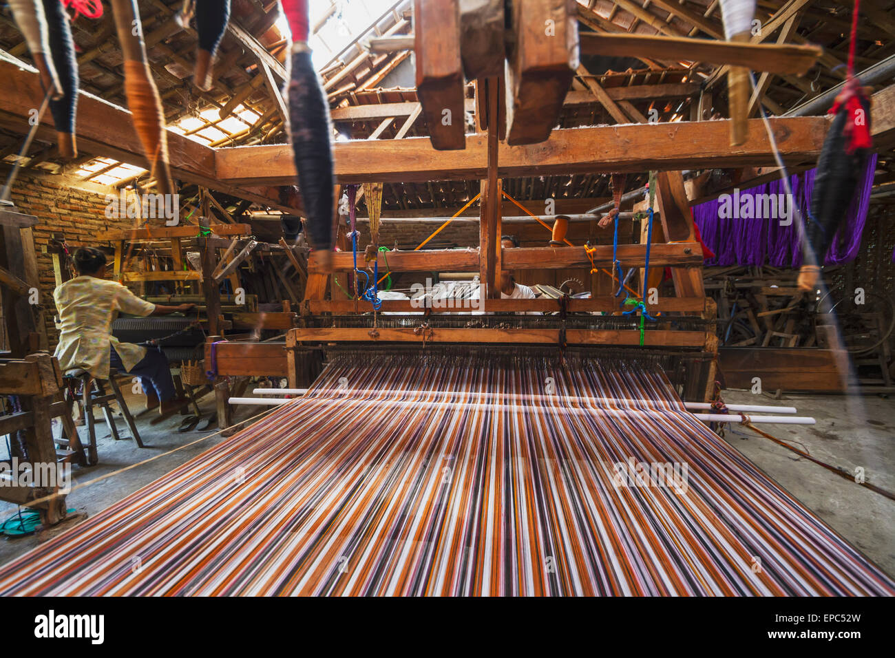 Traditional Lurik cloth being woven on a loom in a lurik workshop in ...