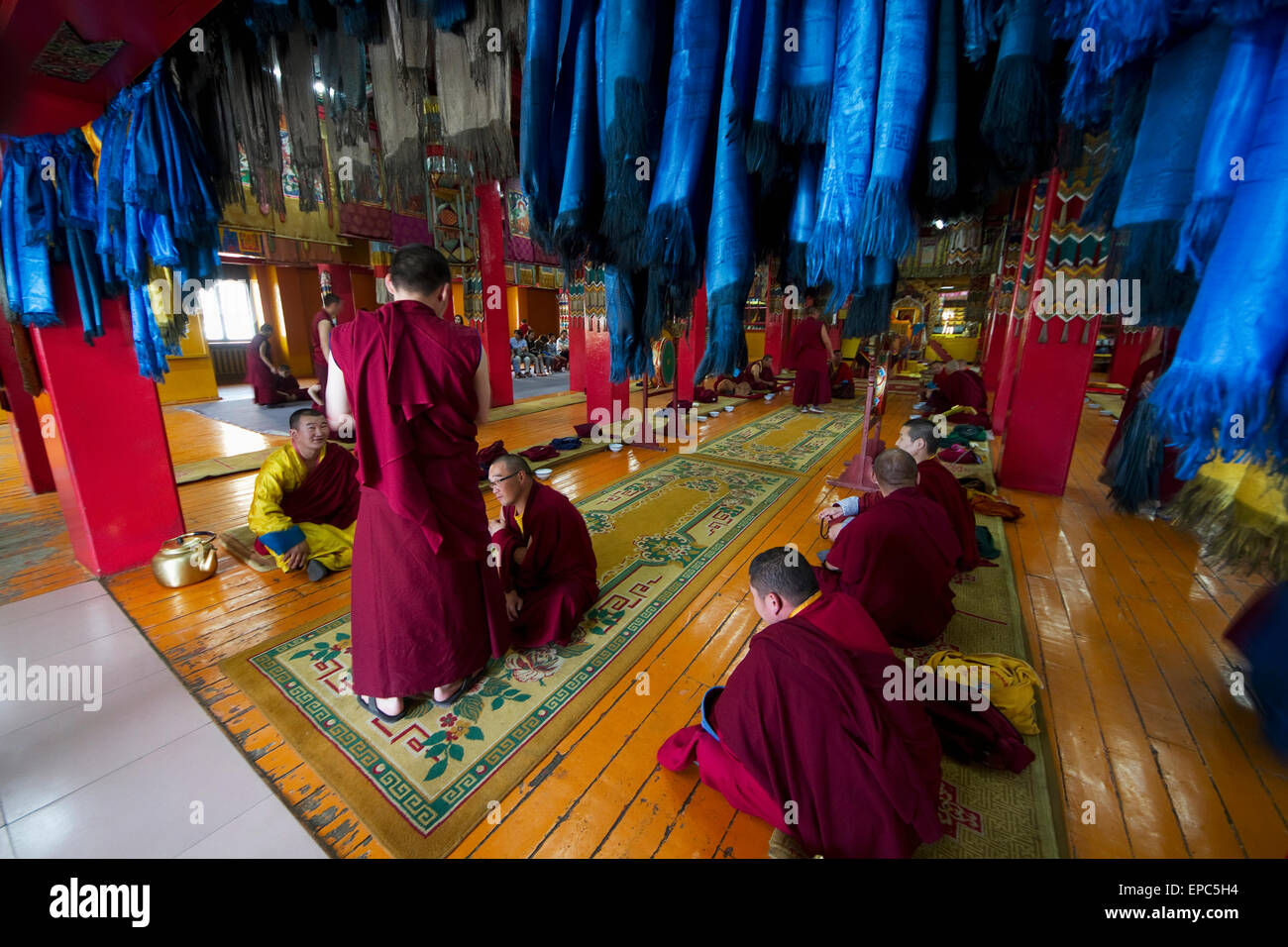 Buddhist monks in the Tashchoimphel Temple at the Gandan Monastery ...